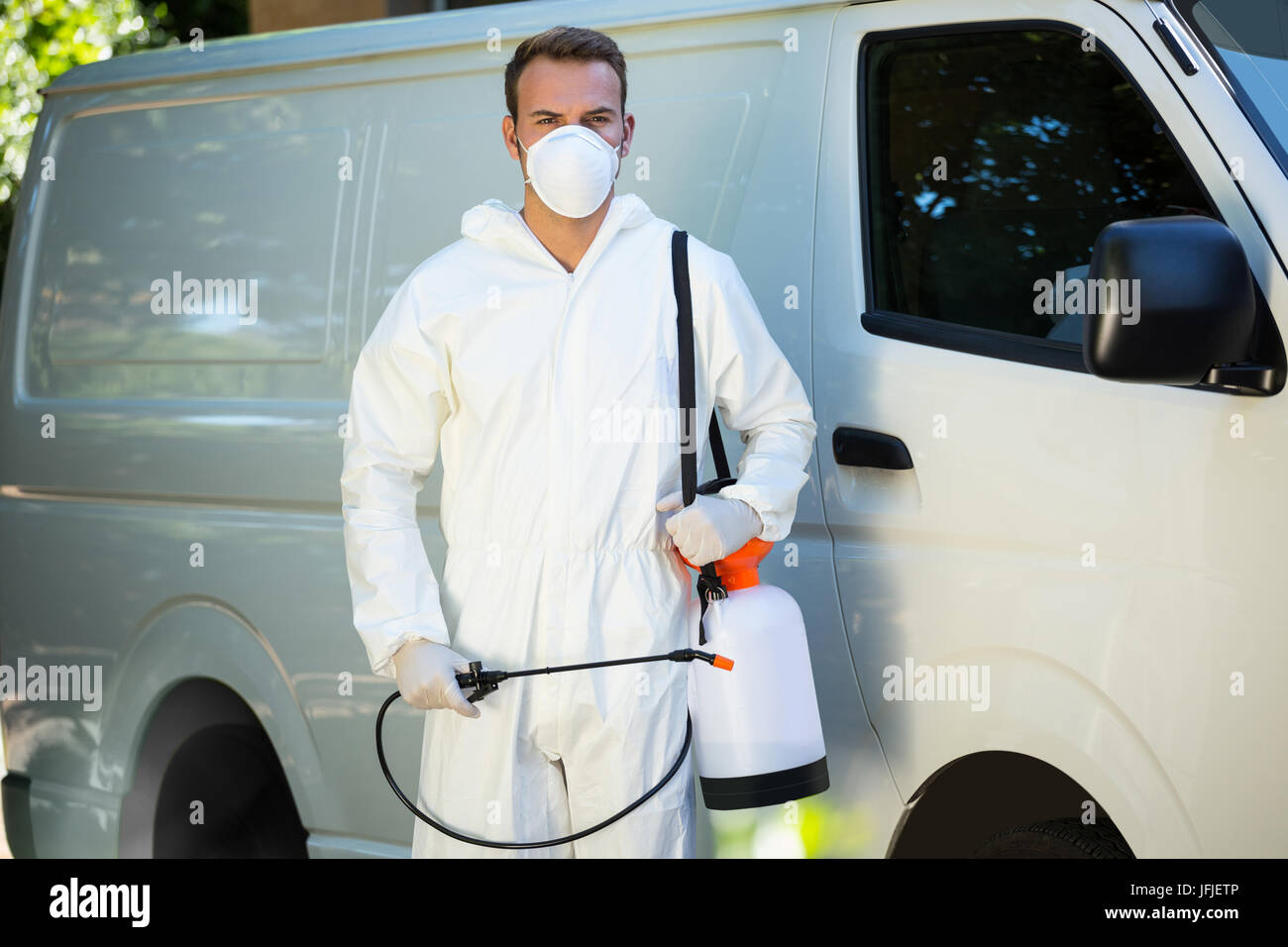 Portrait of pest control man standing next to a van Stock Photo - Alamy