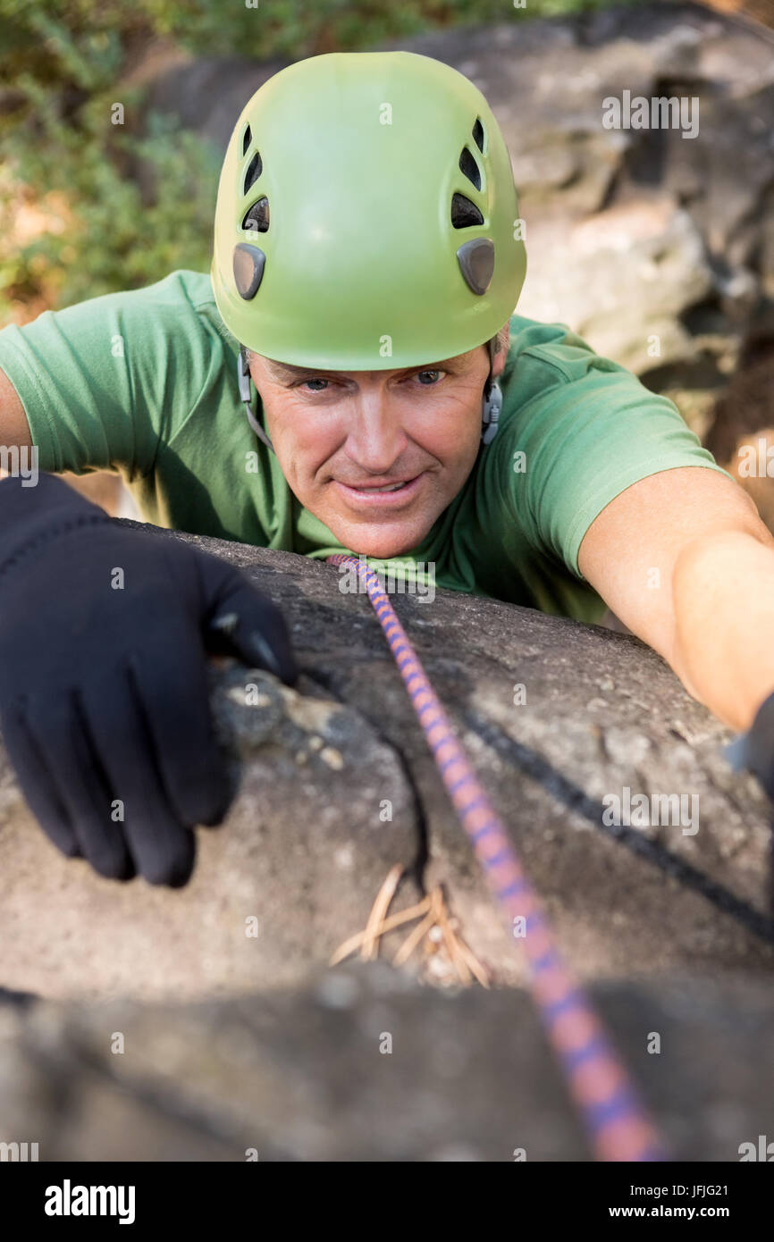 Close up man rock climbing Stock Photo - Alamy