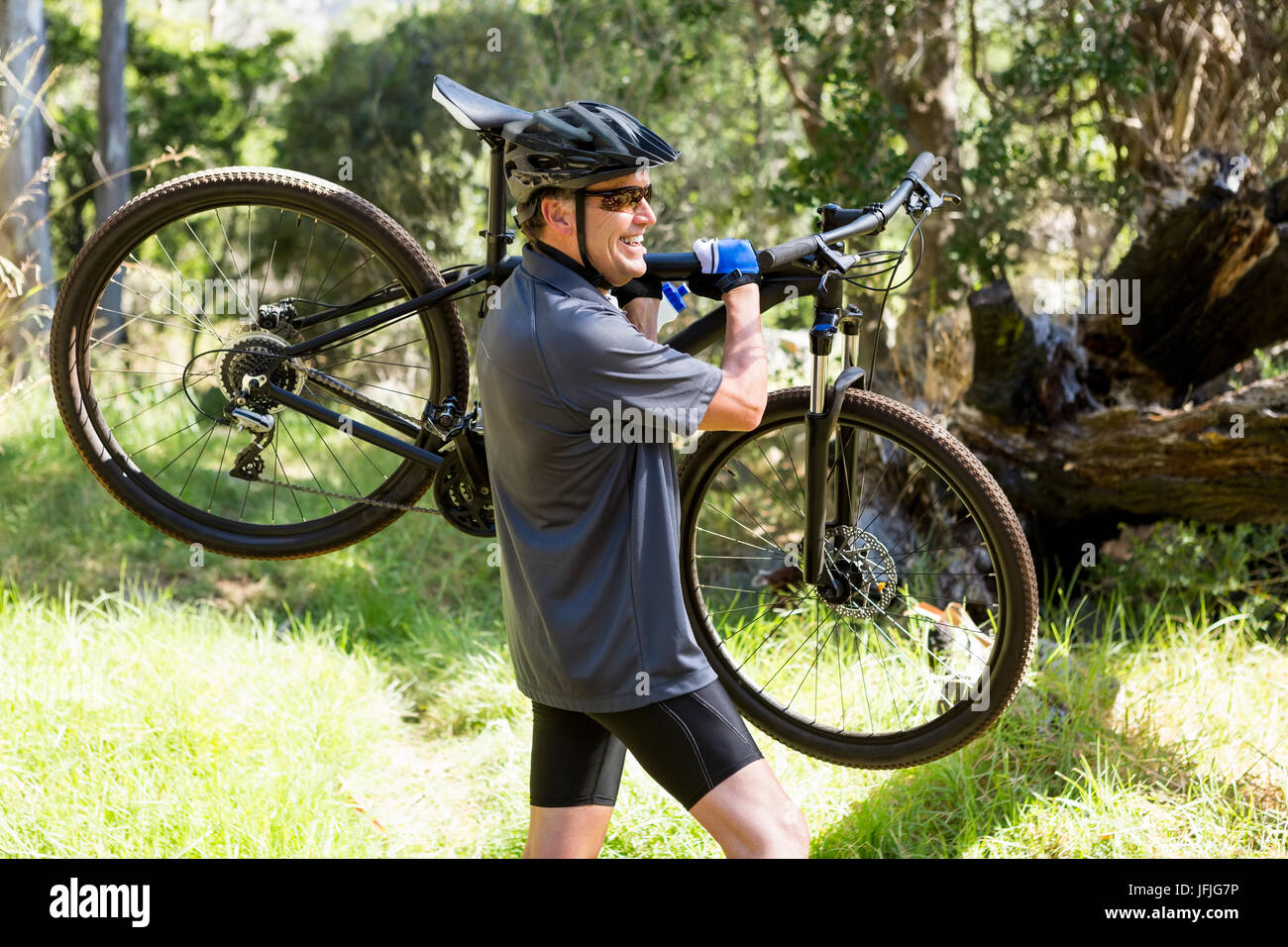 Man taking his bike Stock Photo - Alamy