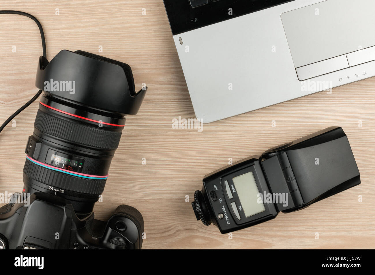 Working table photographer top view, wooden surface with laptop, camera ...