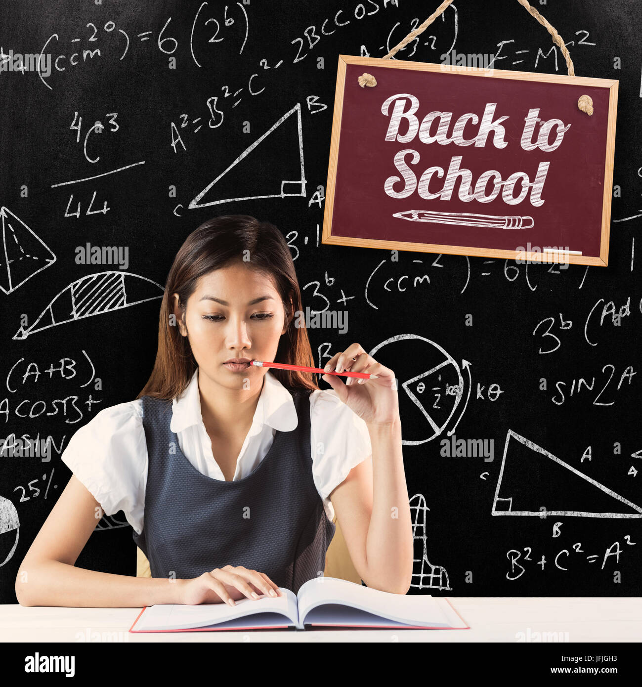 Composite image of thoughtful businesswoman reading Stock Photo - Alamy