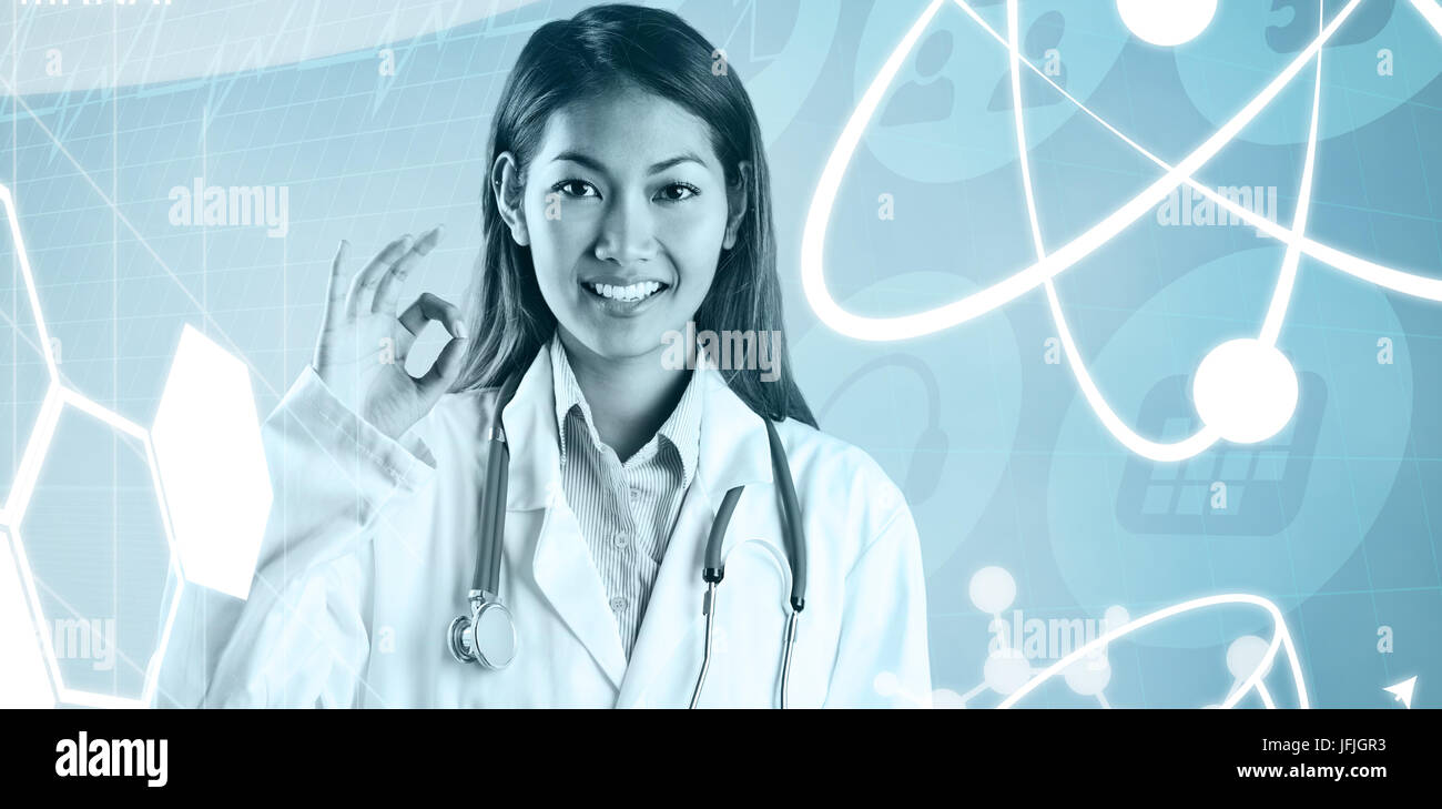 Composite image of asian doctor doing ok sign Stock Photo - Alamy