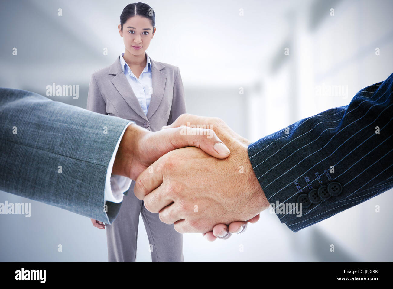 Serious young woman extending hand hi-res stock photography and images ...