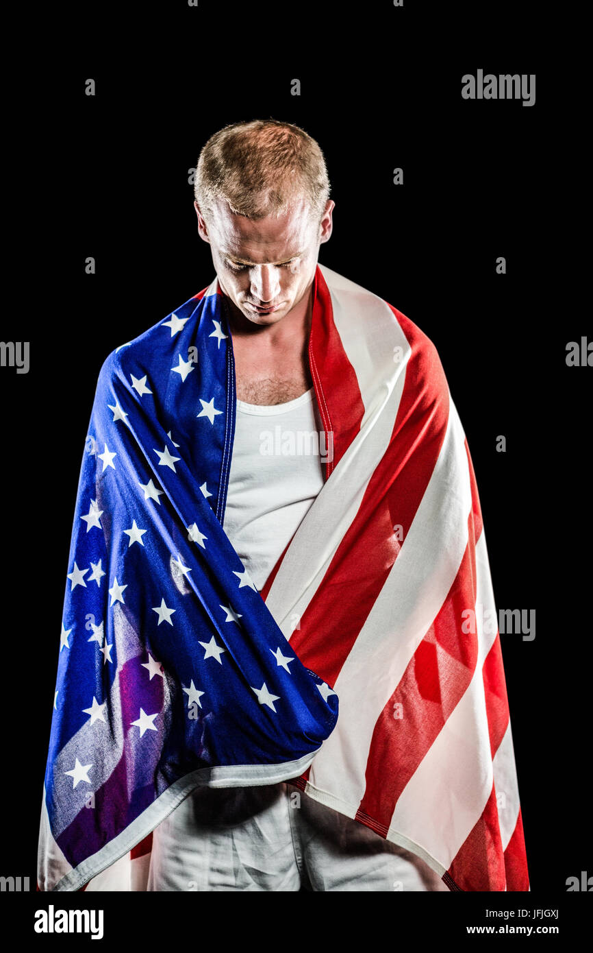 Athlete with american flag wrapped around his body Stock Photo - Alamy