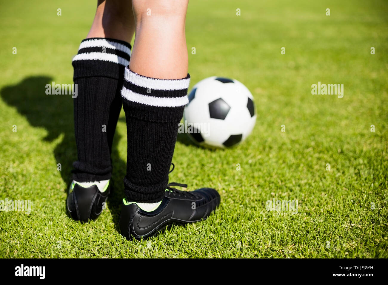 Feet of a female football player and a ball Stock Photo - Alamy