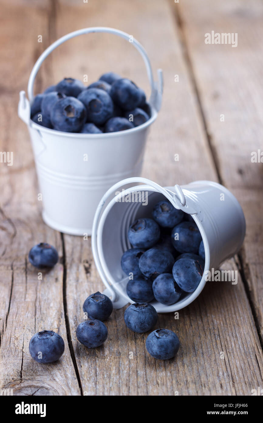 Ripe blueberries in a bucket Stock Photo - Alamy