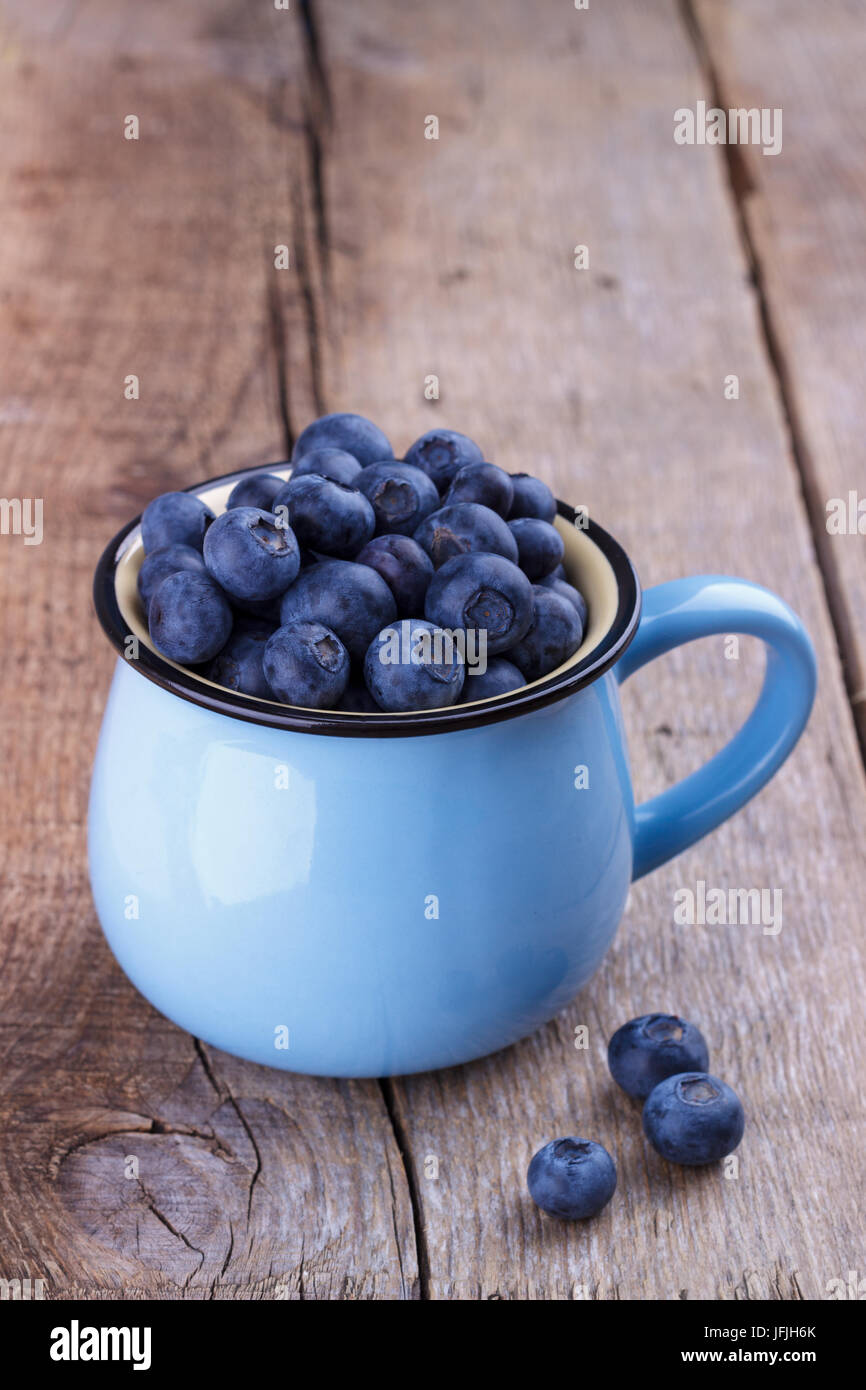 Blueberries in wooden cup hi-res stock photography and images - Alamy