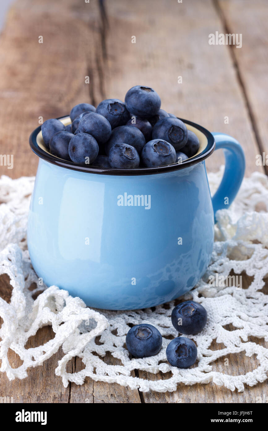 Blueberries in wooden cup hi-res stock photography and images - Alamy