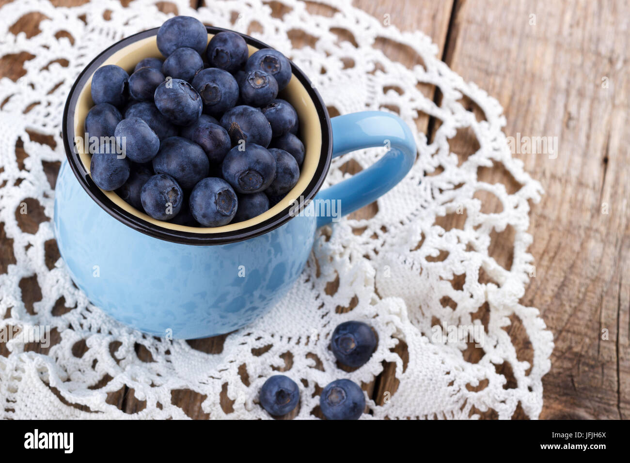 Blueberries in wooden cup hi-res stock photography and images - Alamy