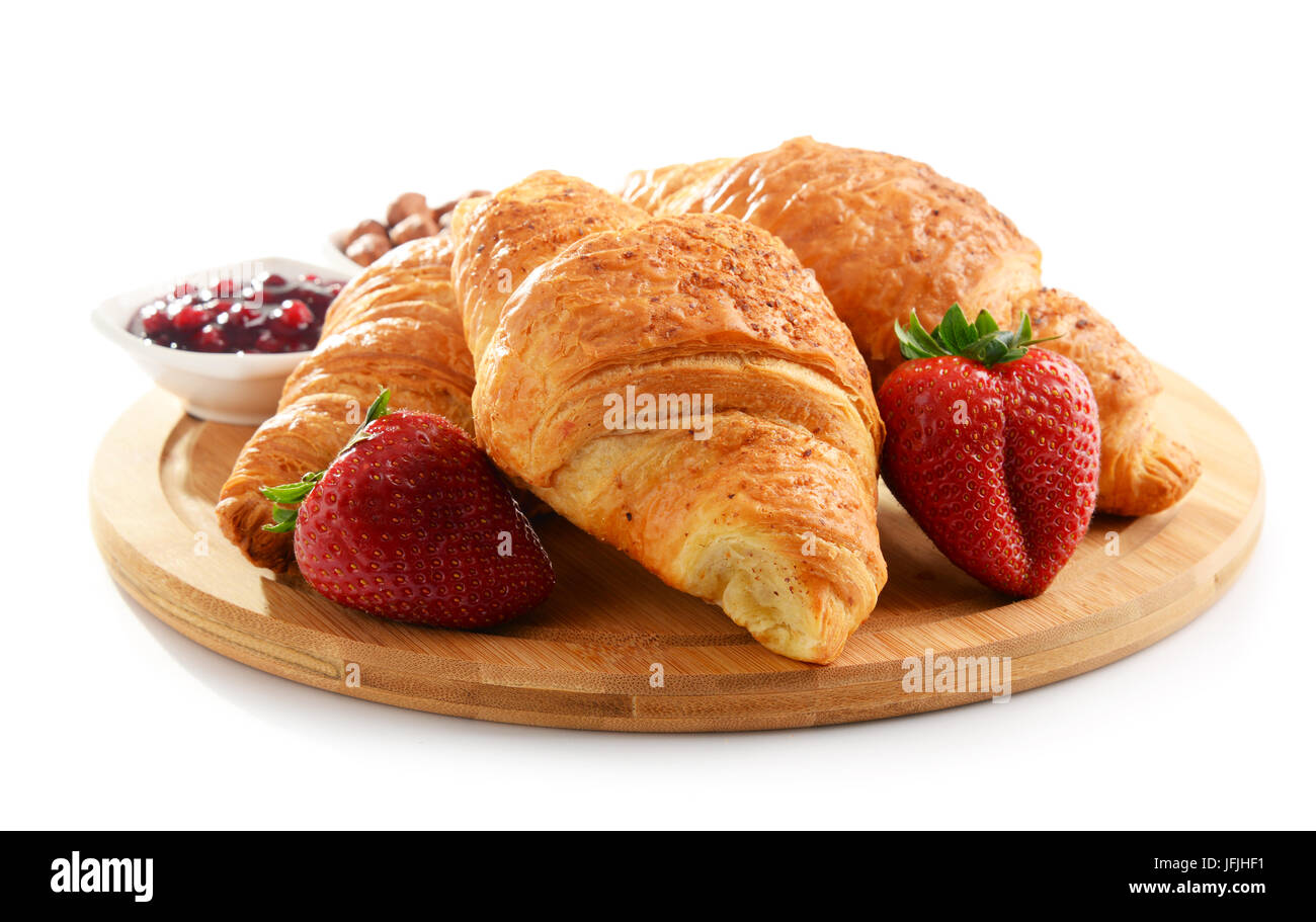 Composition with breakfast on the cutting board isolated on white Stock ...