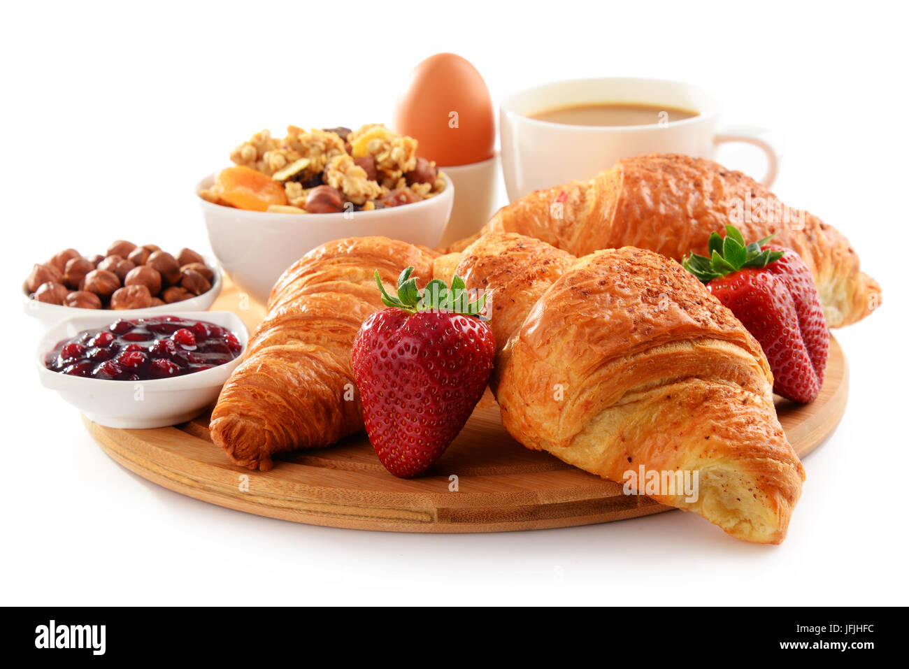 Composition with breakfast on the cutting board isolated on white Stock ...