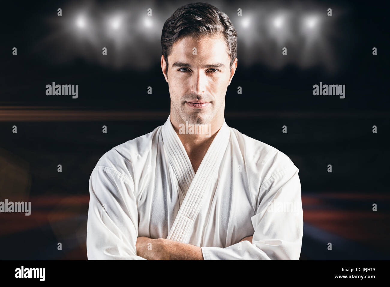 Composite image of portrait of fighter standing on black background ...