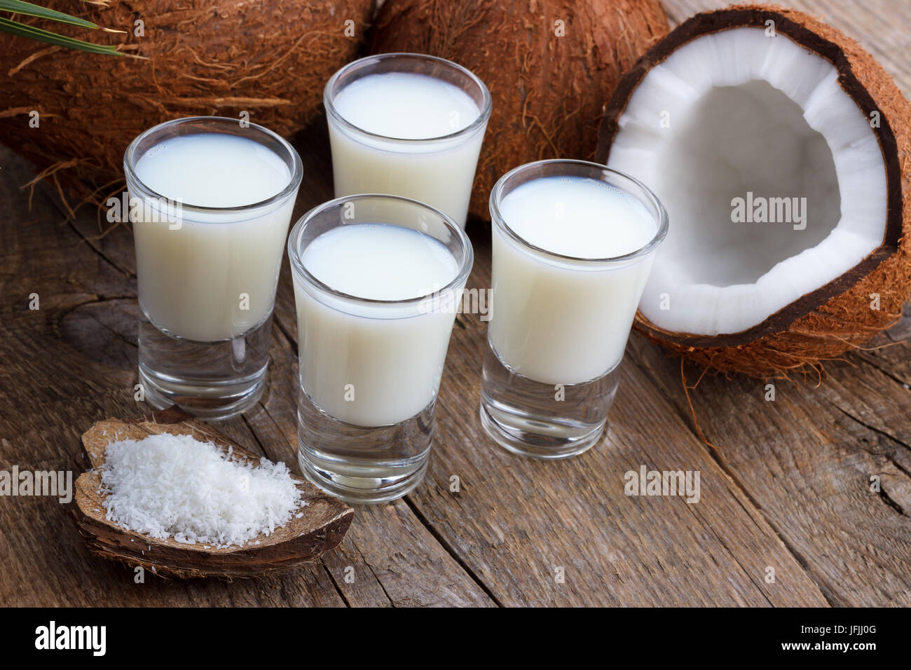 Coconut milk and shells Stock Photo - Alamy