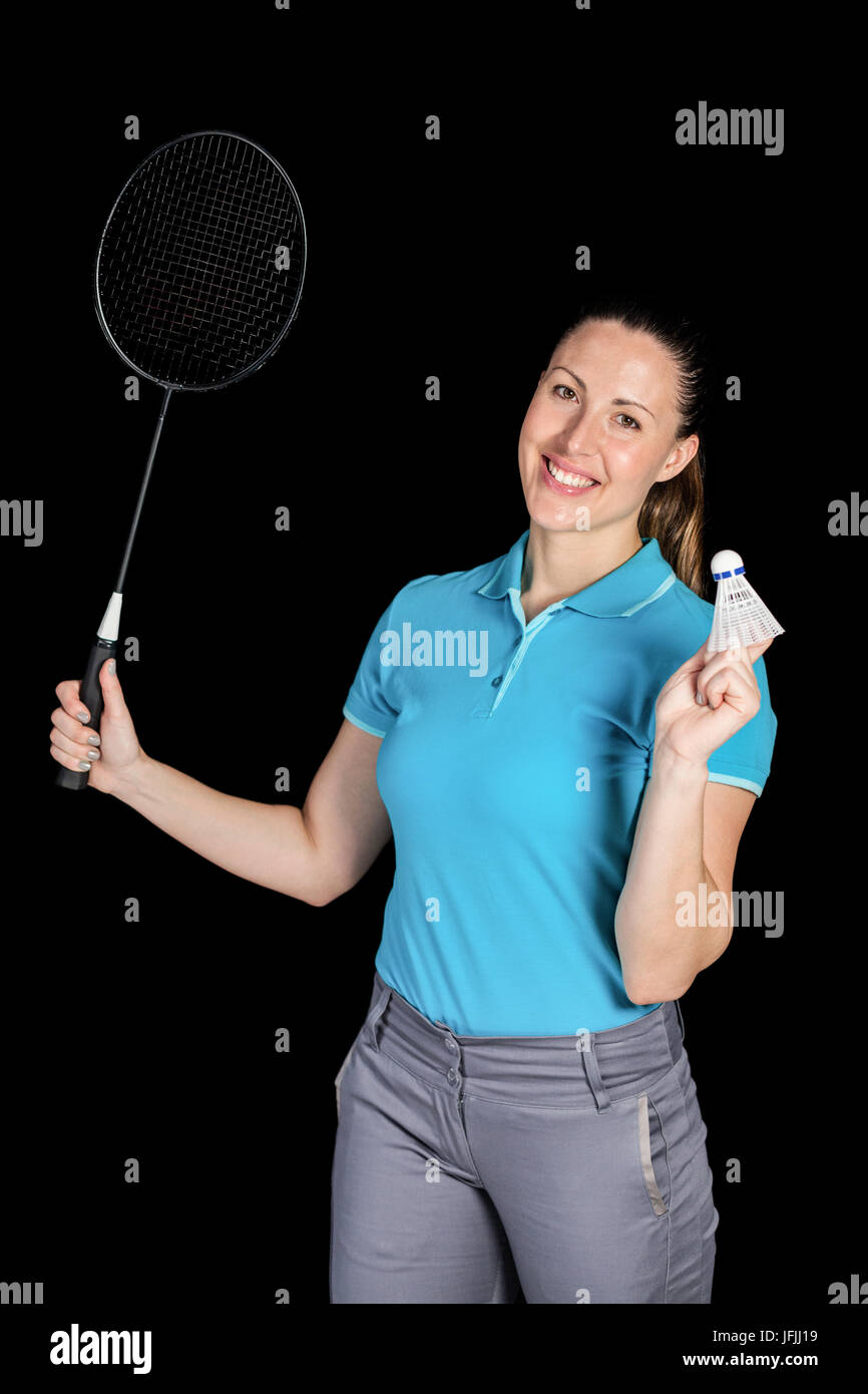 Badminton player holding badminton racket and shuttlecock Stock Photo ...