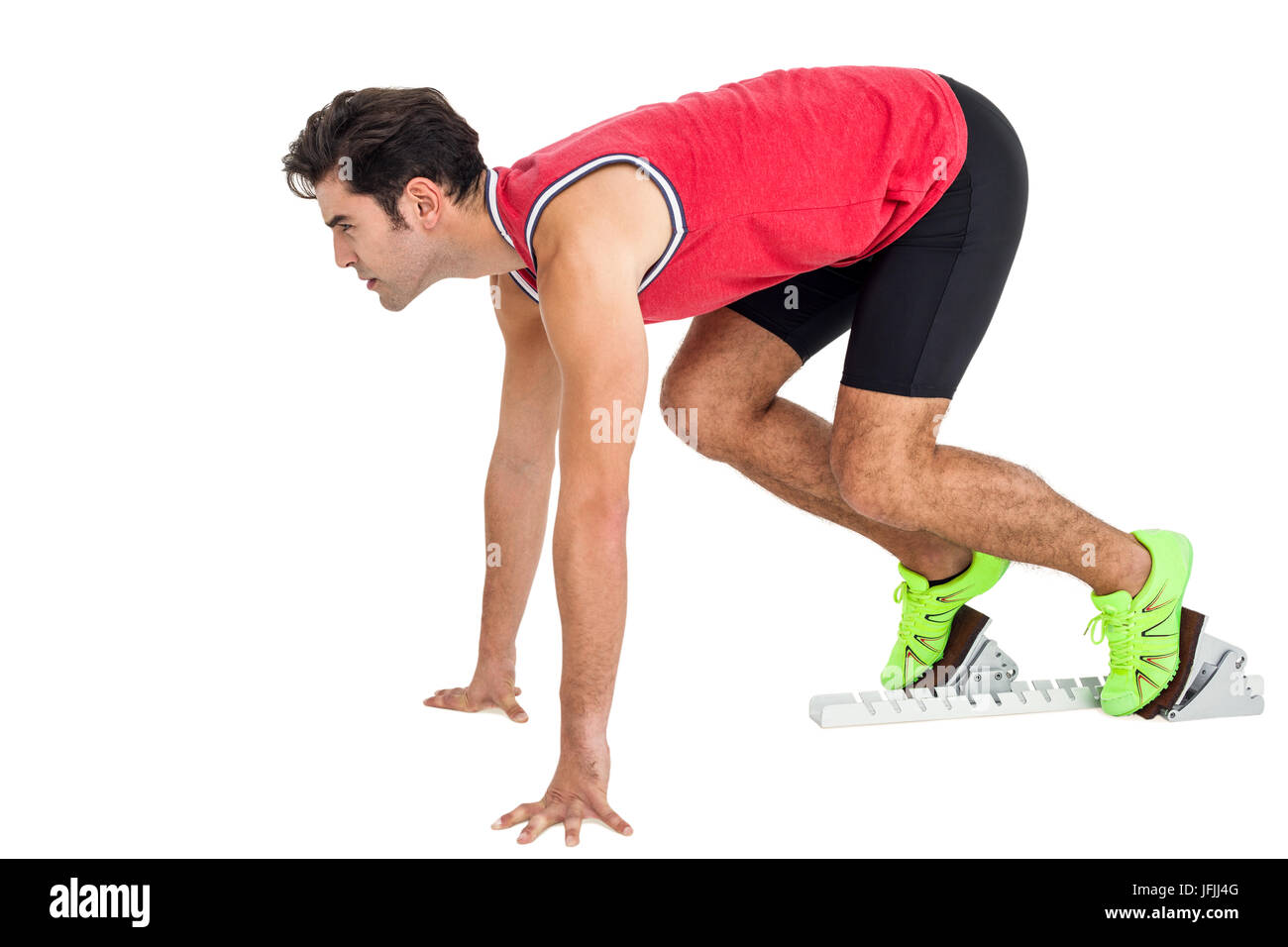 Confident male athlete in ready to run position Stock Photo - Alamy