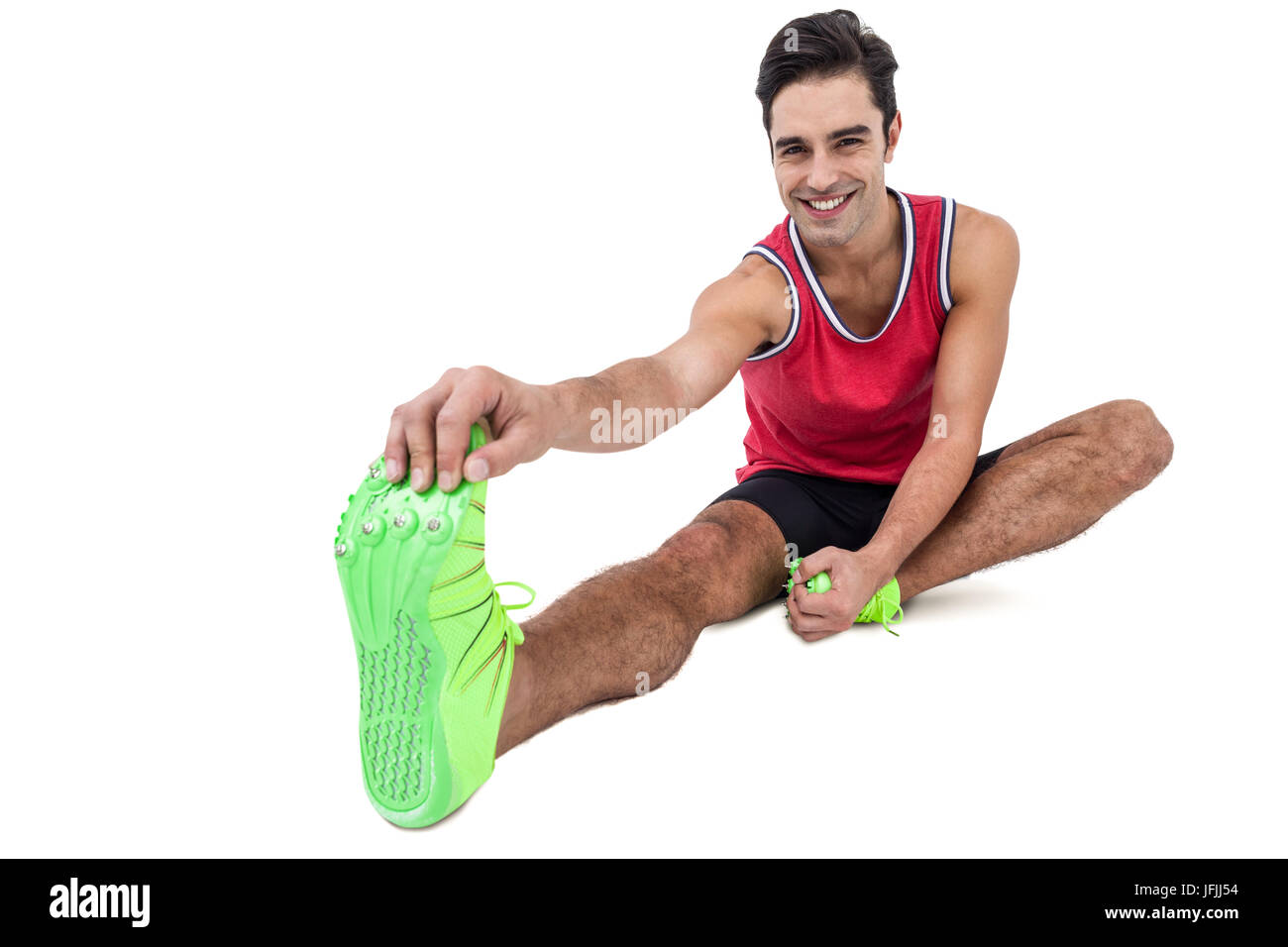 Portrait of male athlete doing stretching exercise Stock Photo - Alamy