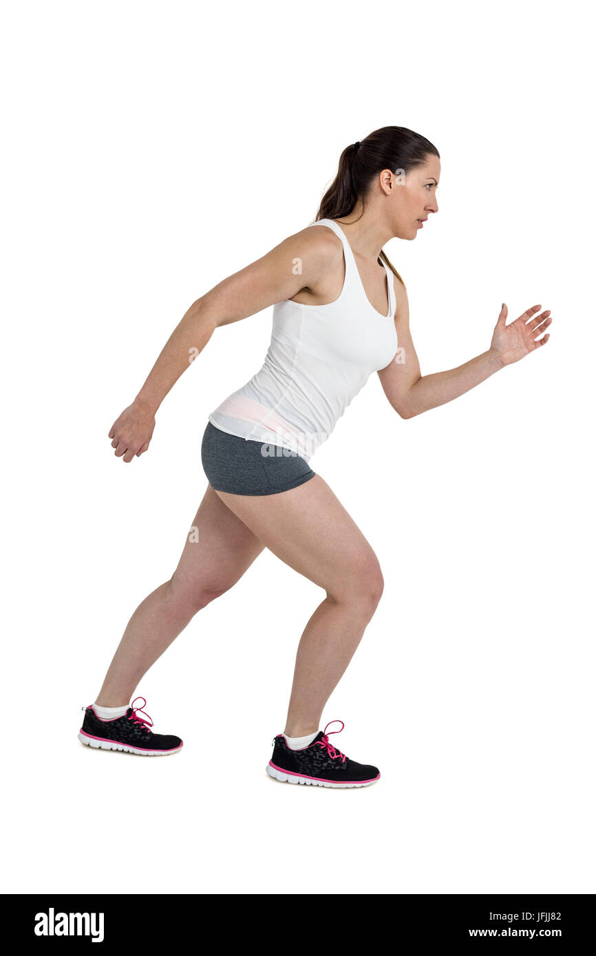 Side view of energetic female athlete running Stock Photo - Alamy