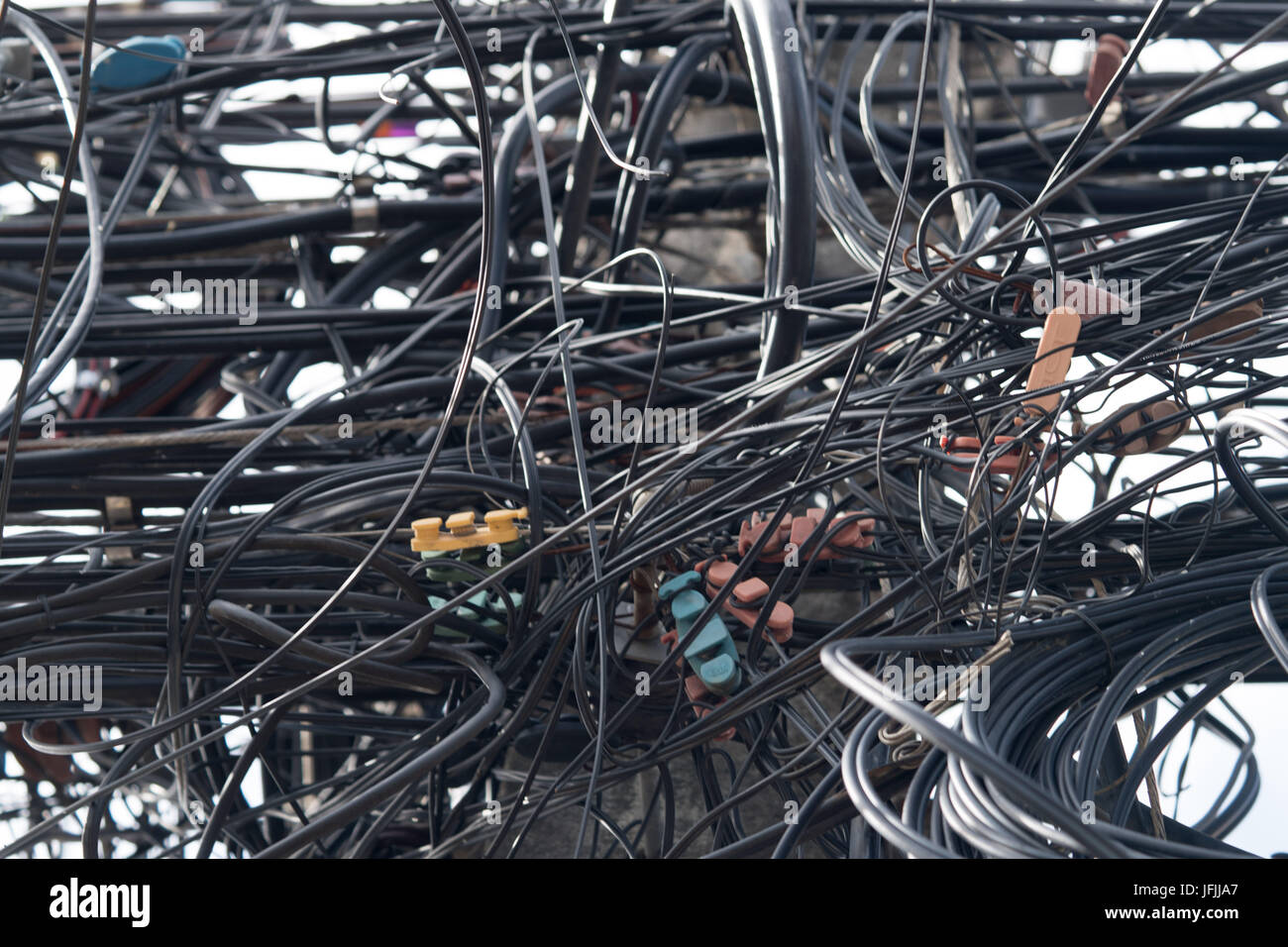 Macro closeup bottom view of very messy tangled electrical cables Stock ...