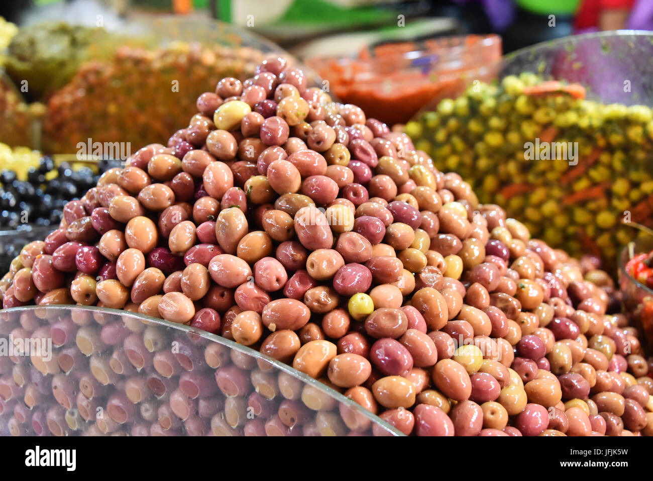 Assorted olives on the arab street market stall Stock Photo - Alamy