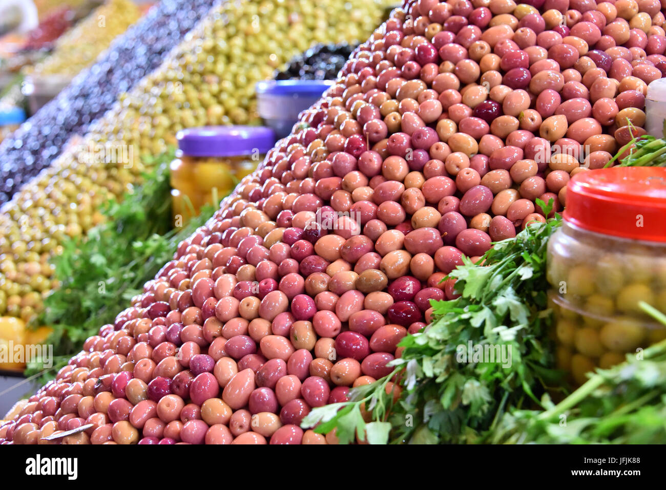 Assorted olives on the arab street market stall Stock Photo - Alamy