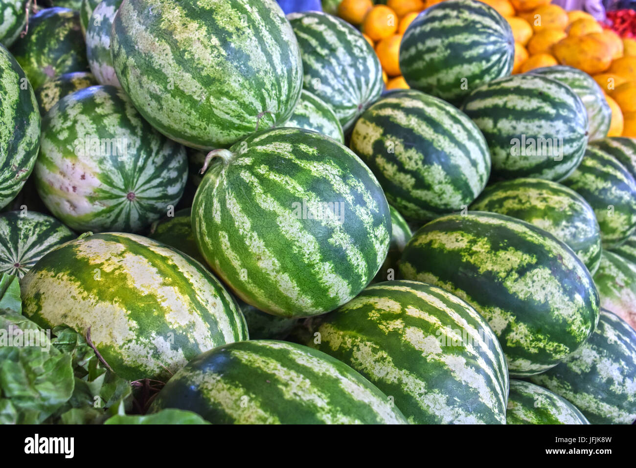 Watermelons on street market stall Stock Photo - Alamy