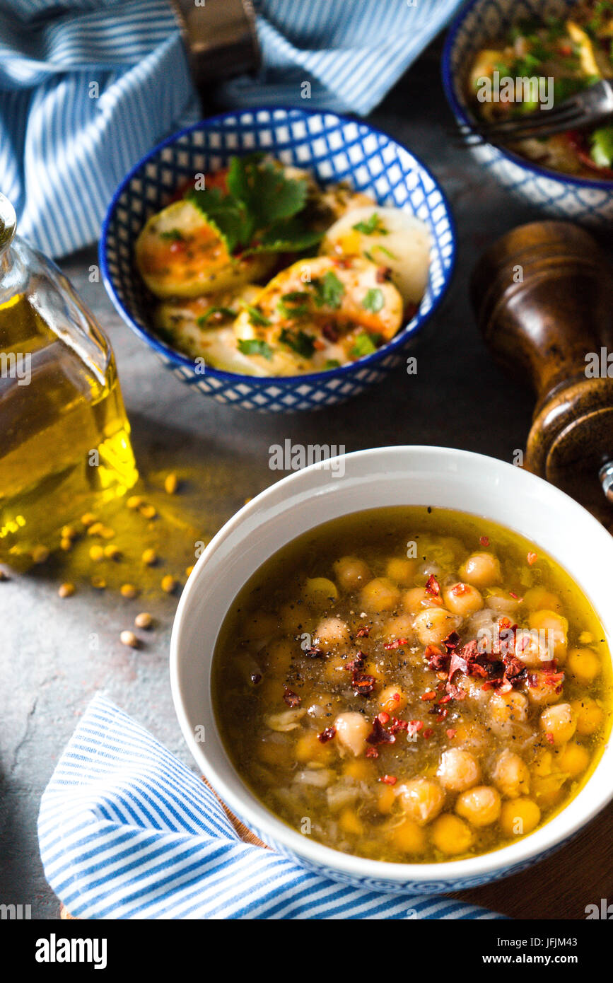 Greek chickpea soup Revithia on the stone background top view vertical ...