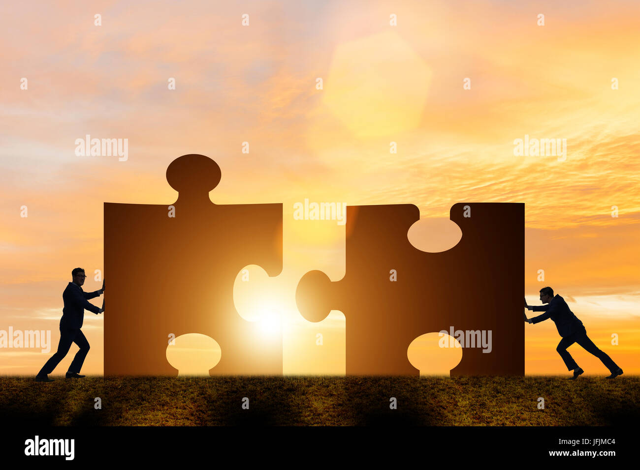 Business concept of teamwork with jigsaw puzzle Stock Photo - Alamy