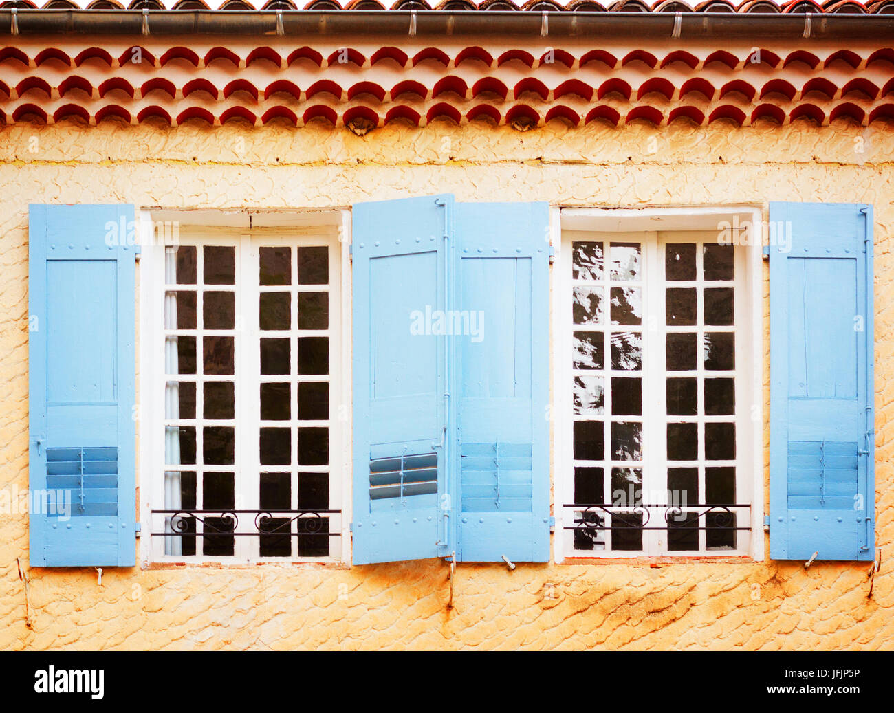 Windows with blue shutters, beautiful details of provencal typical ...