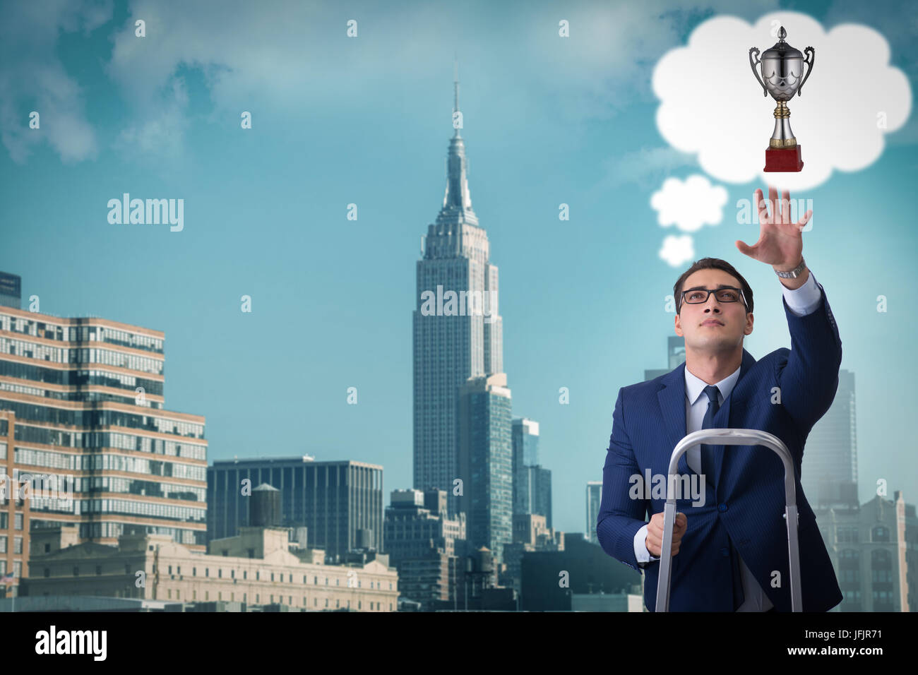 Businessman climbing towards his business goal Stock Photo - Alamy