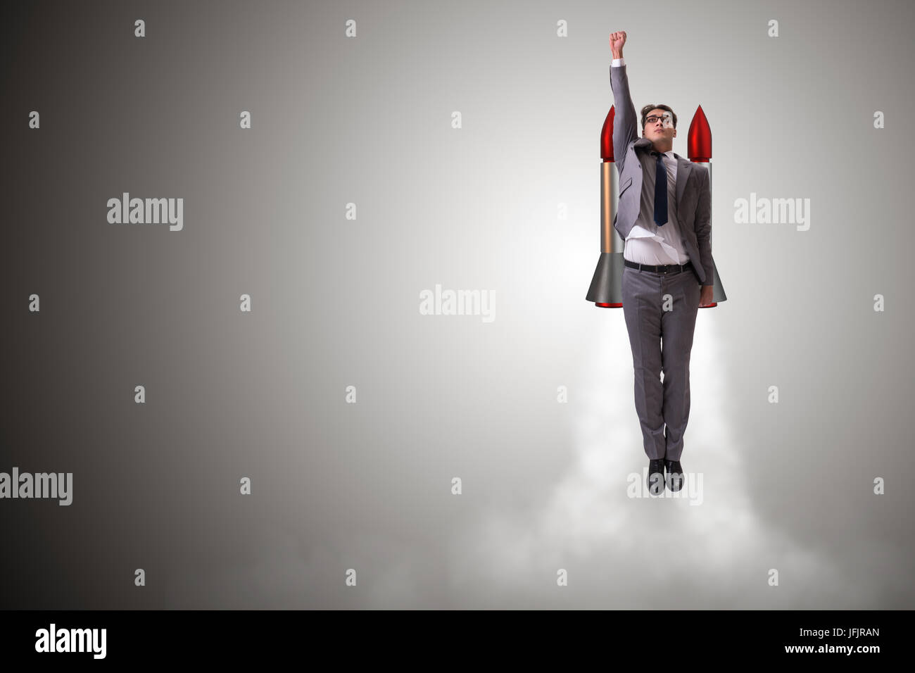 Man flying with the rocket in business concept Stock Photo - Alamy