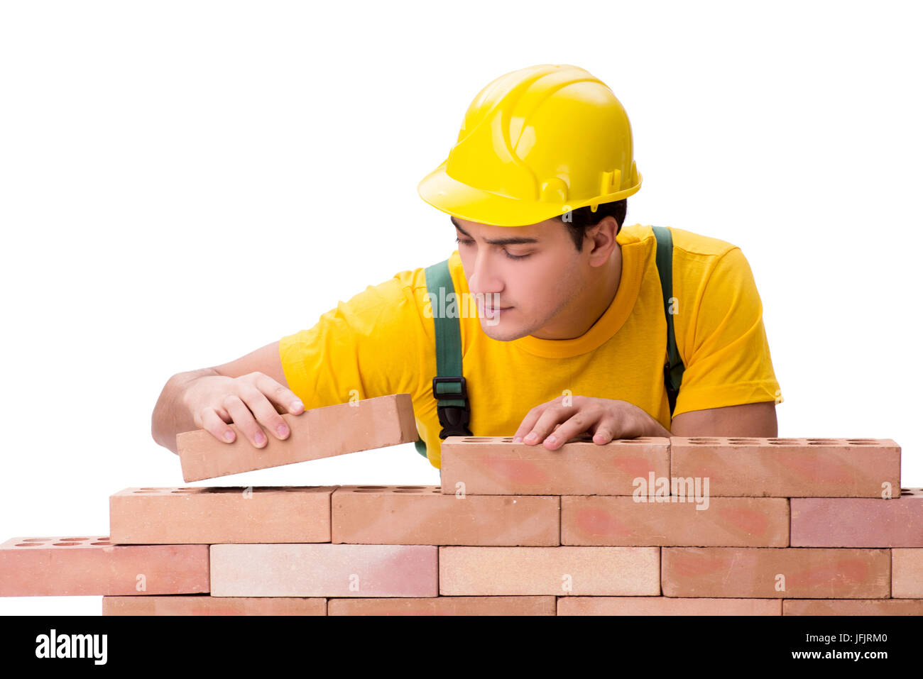 Handsome construction worker building brick wall Stock Photo - Alamy