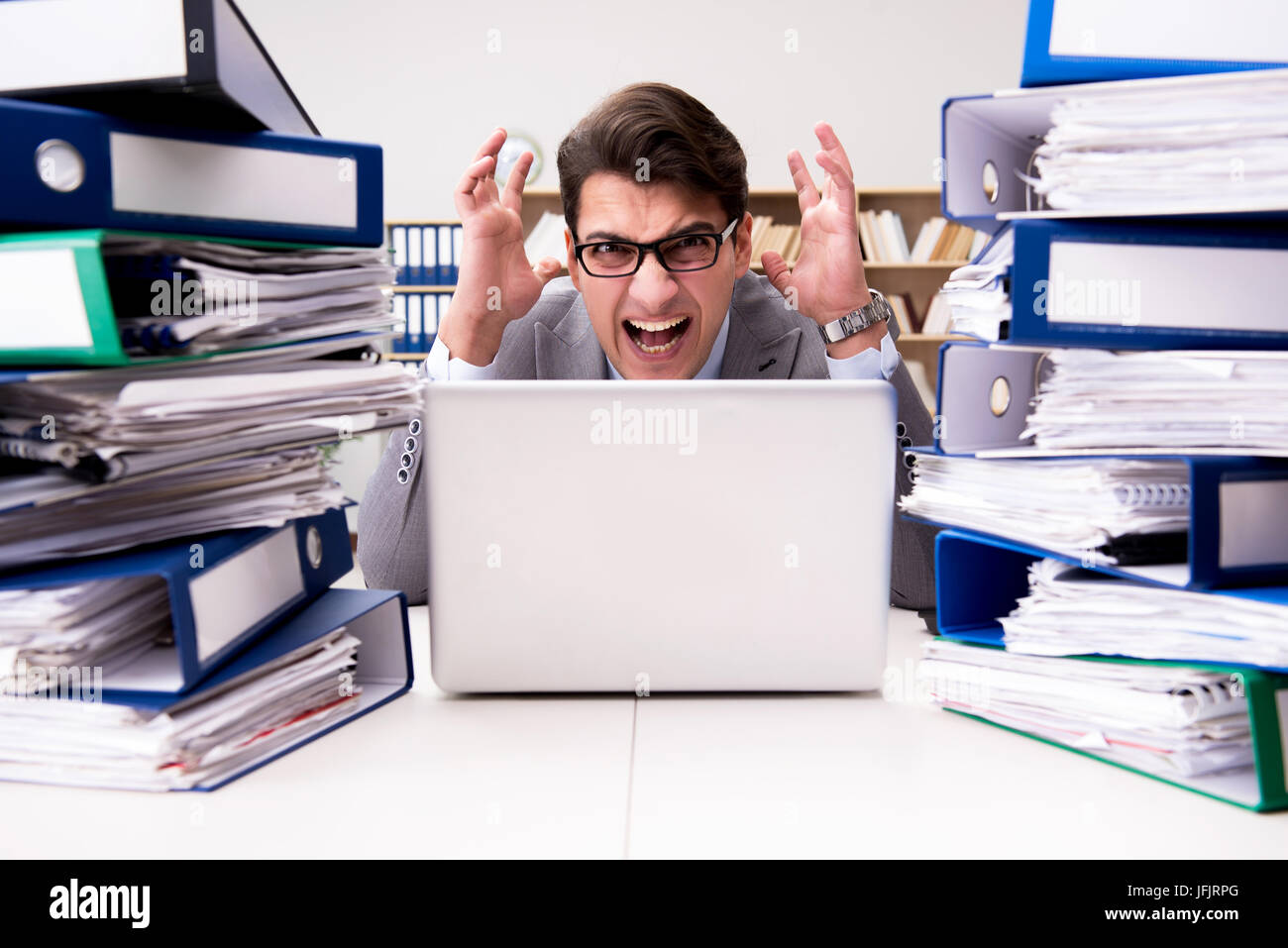 Busy businessman under stress due to excessive work Stock Photo - Alamy