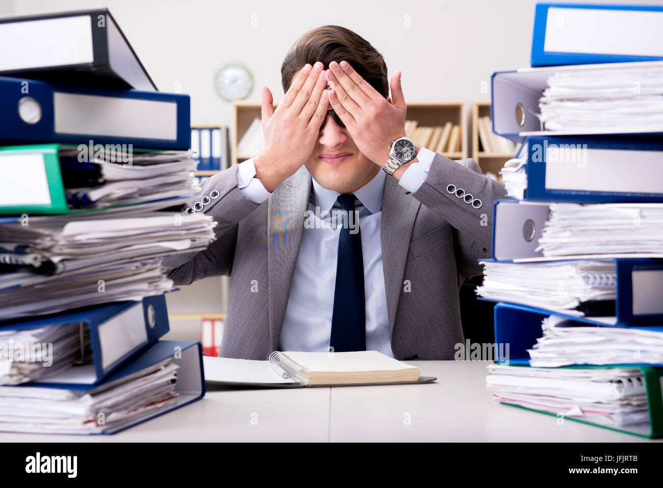 Busy businessman under stress due to excessive work Stock Photo - Alamy
