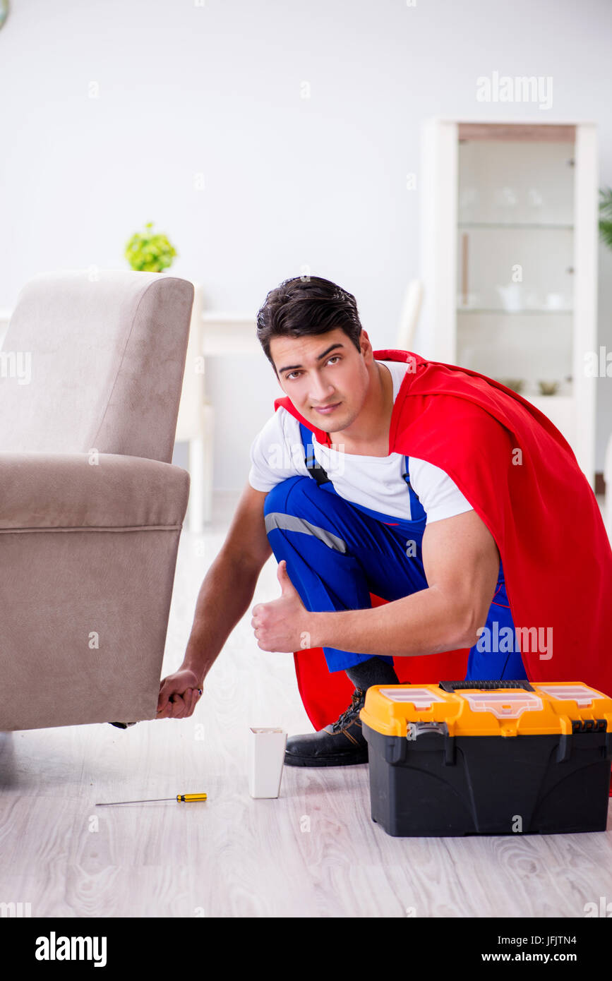 Superhero repairman with tools in repair concept Stock Photo - Alamy
