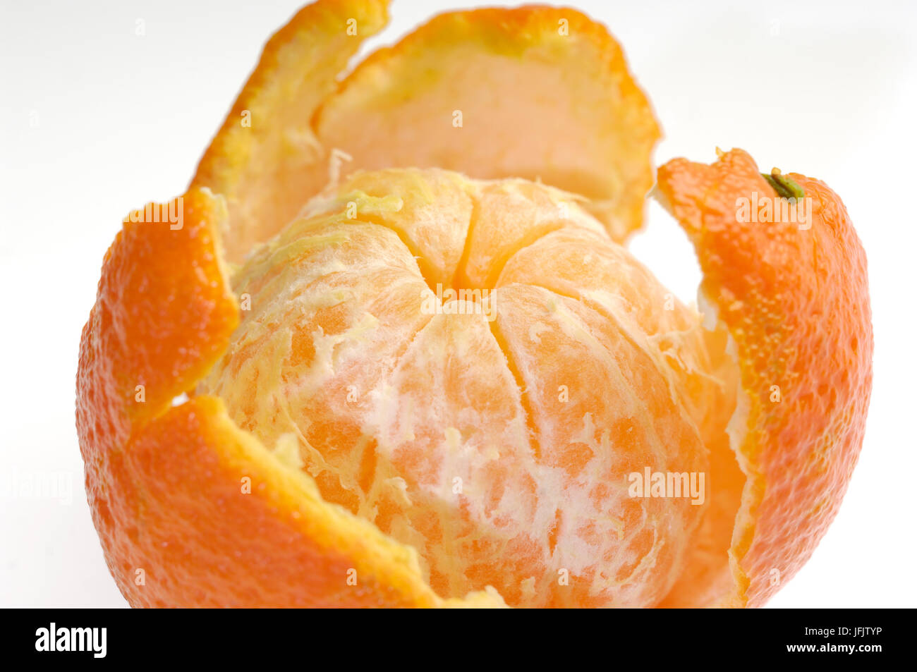 Peeled fruit with orange peel isolated on white background Stock Photo ...