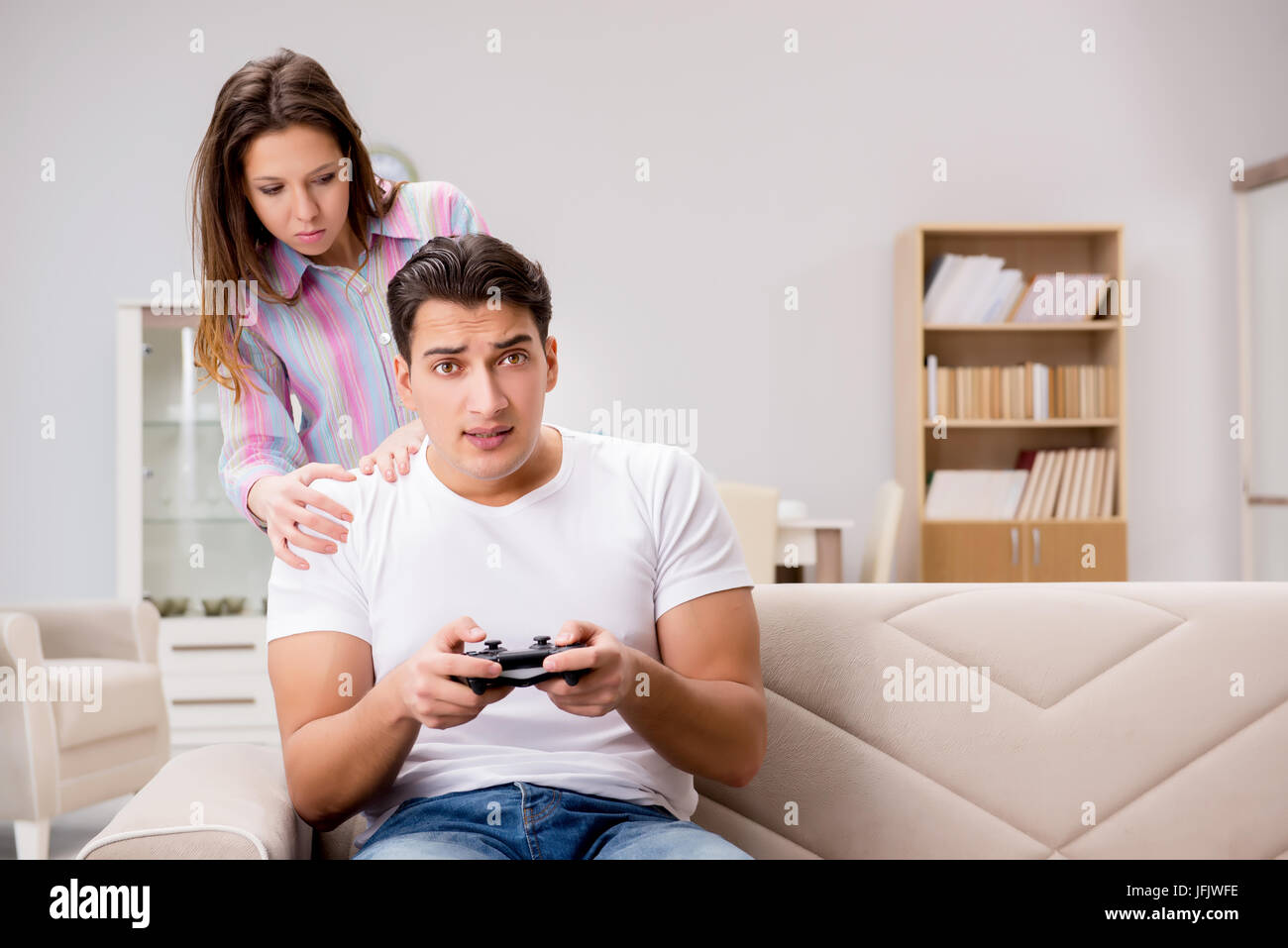 Young family suffering from computer games addiction Stock Photo - Alamy
