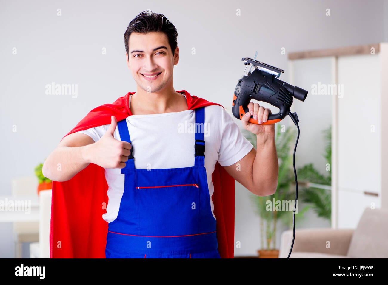 Superhero repairman with tools in repair concept Stock Photo - Alamy