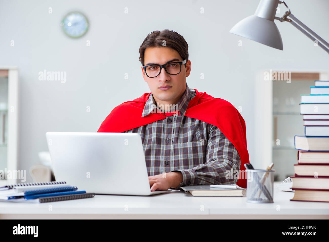 Super hero student with books studying for exams Stock Photo - Alamy