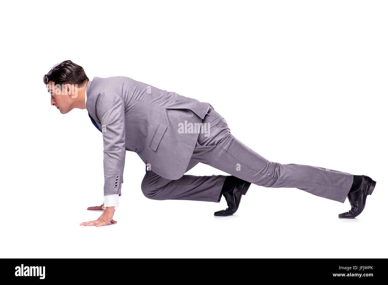 Businessman on start ready for running isolated on white Stock Photo ...