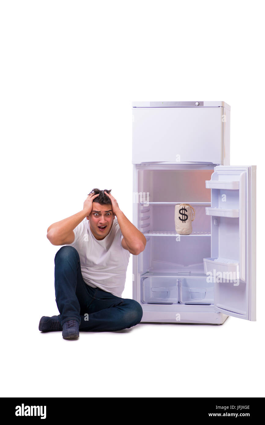 Hungry man looking for money to fill the fridge Stock Photo - Alamy