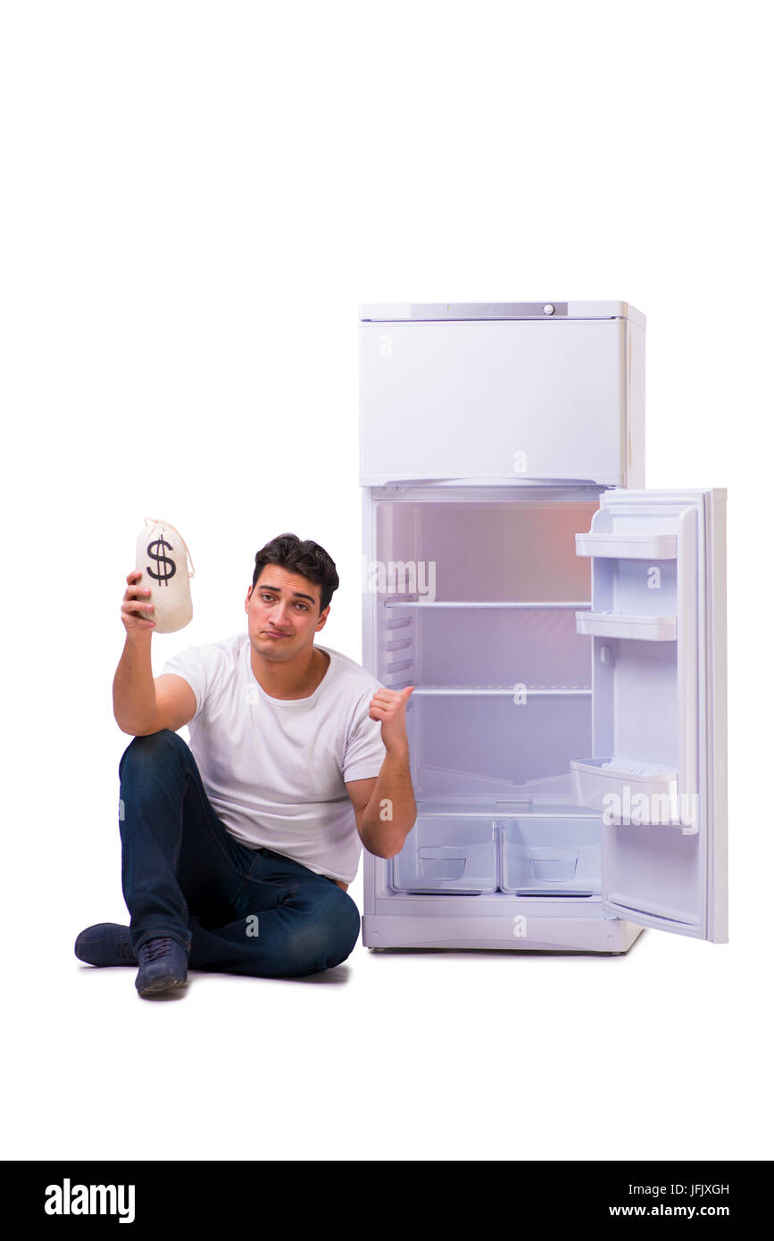Hungry man looking for money to fill the fridge Stock Photo - Alamy