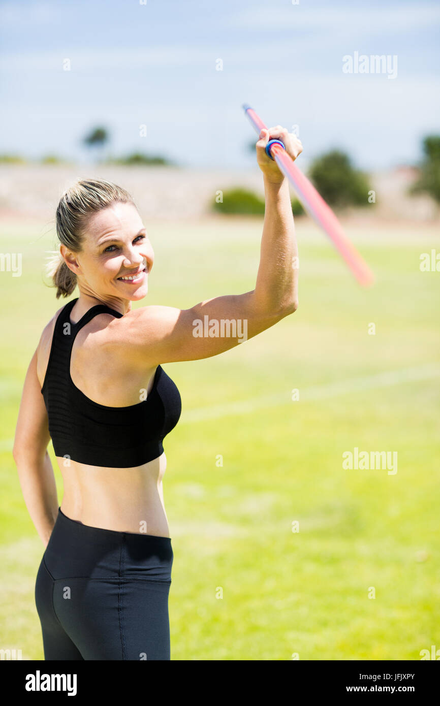 Happy athlete standing javelin hi-res stock photography and images - Alamy
