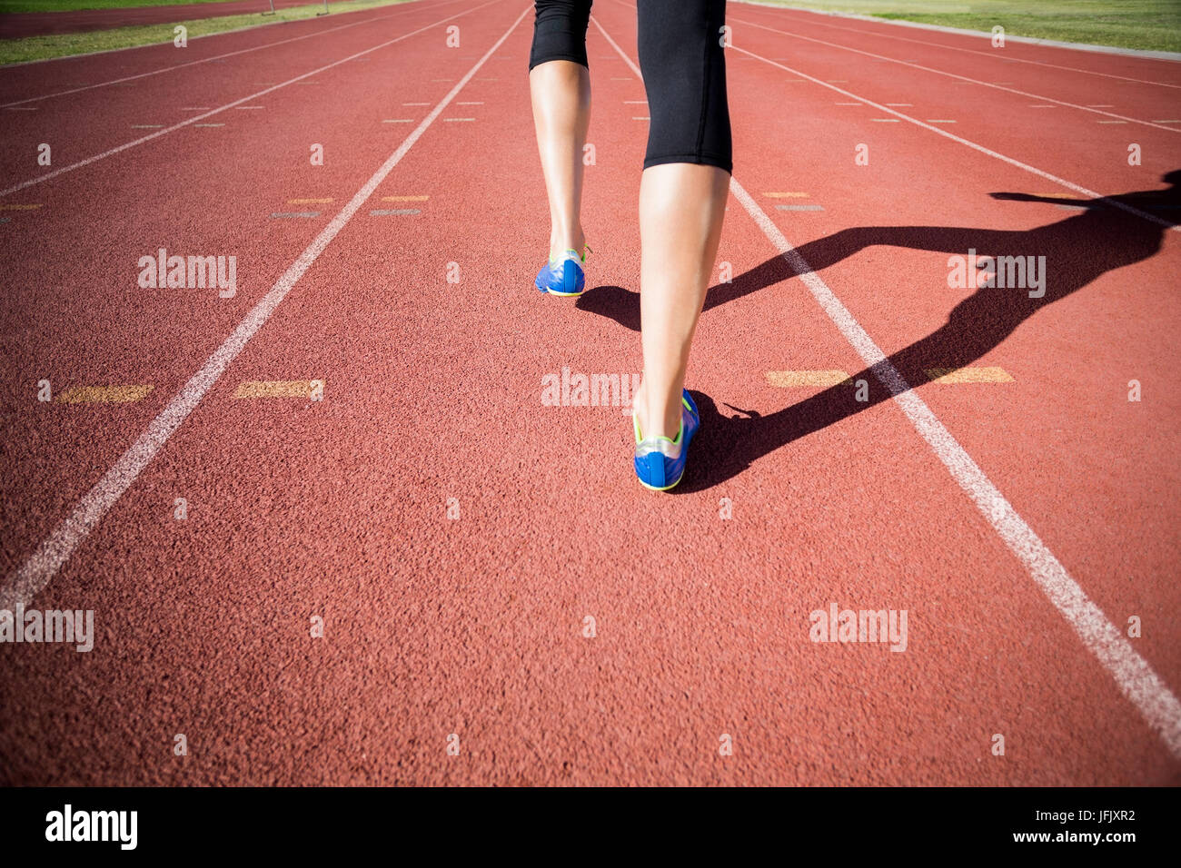 Female athlete feet running on the running track Stock Photo - Alamy