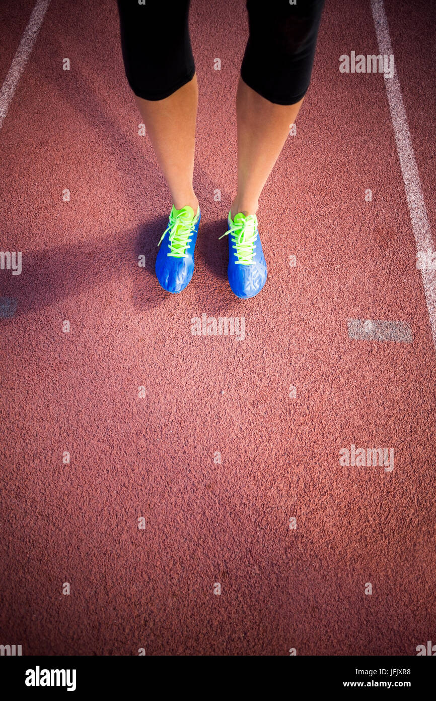Female athlete feet standing on the running track Stock Photo - Alamy