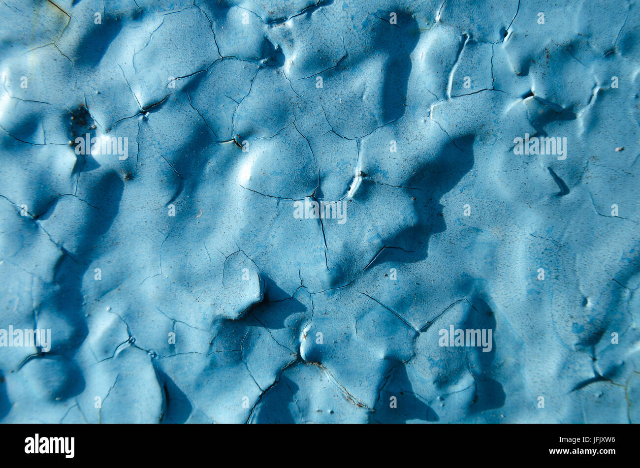 The texture is dense cracked blue paint Stock Photo - Alamy