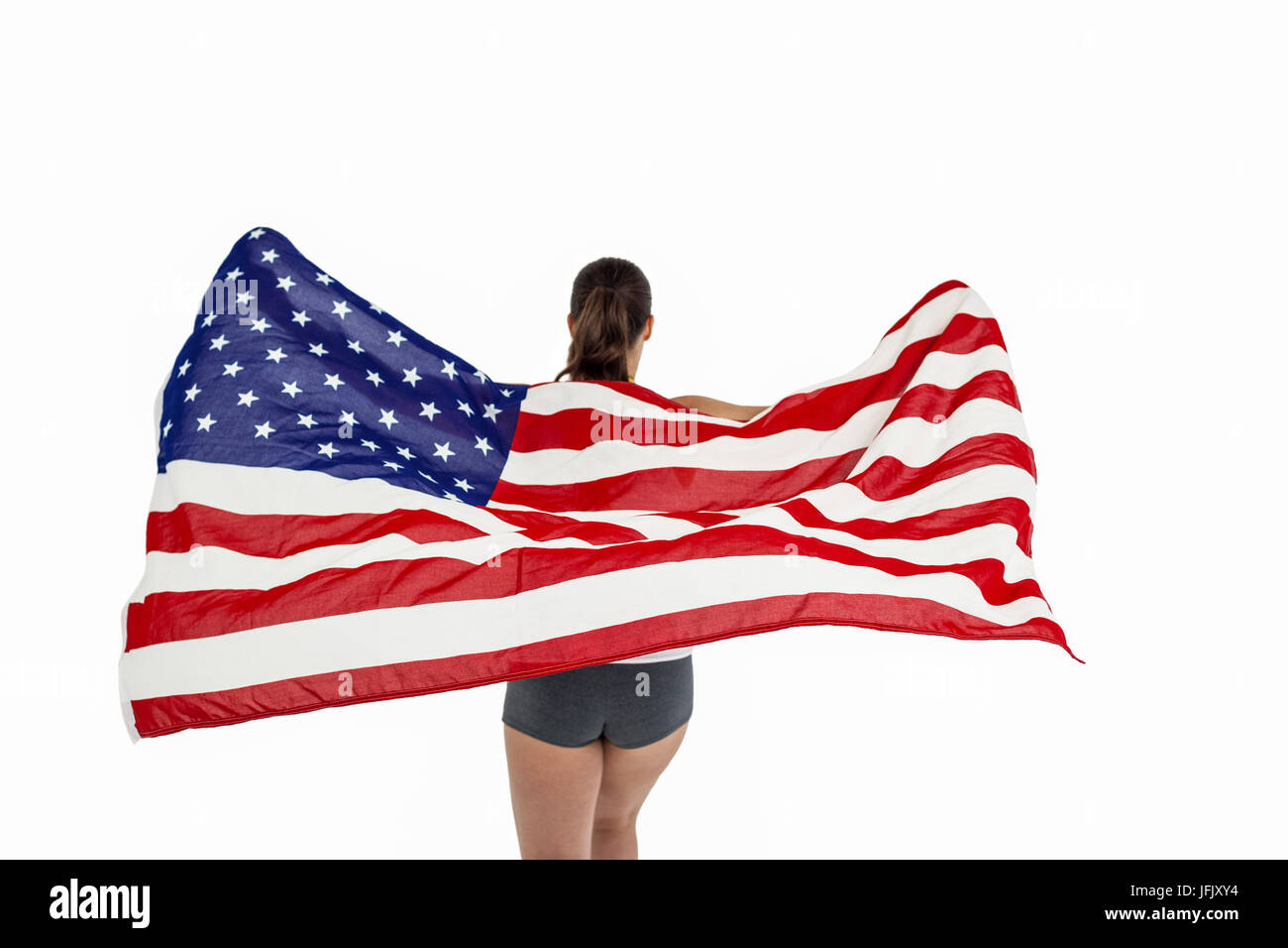 Athlete posing with american flag after victory Stock Photo - Alamy