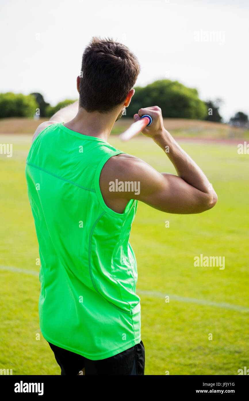 Rear view of an athlete about to throw a javelin Stock Photo - Alamy