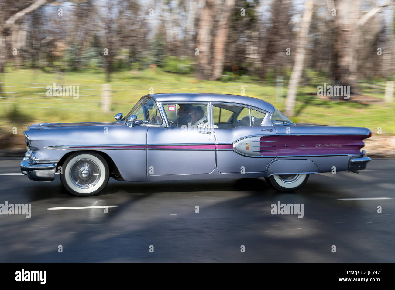 Vintage 1958 Pontiac Strato Chief Sedan driving on country roads near ...