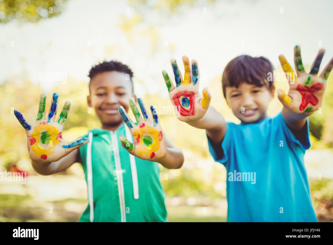 Portrait of two boys showing their hands to the camera Stock Photo - Alamy