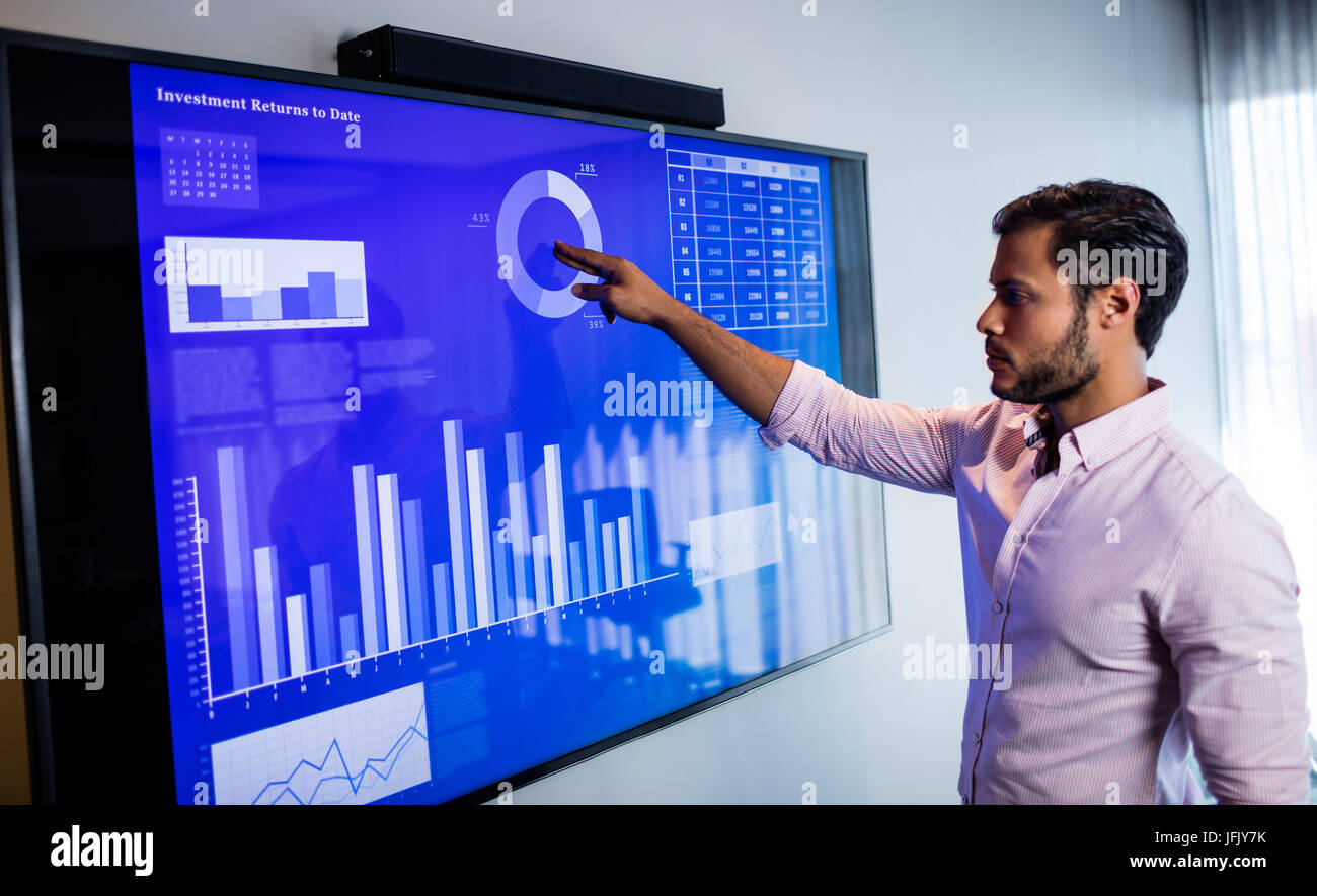 Businessman analyzing data with a touch screen Stock Photo - Alamy